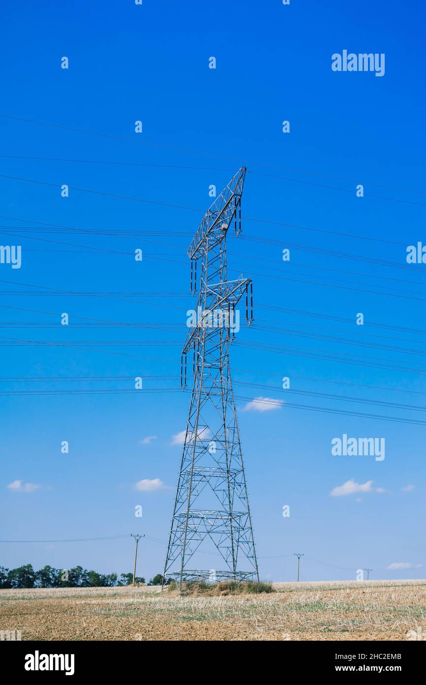 Electric power transmission lines at sky background, an autumn field ...