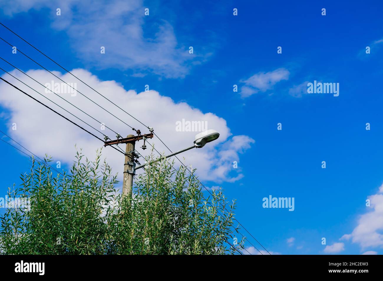 Electric power transmission lines at sky background, an autumn field ...