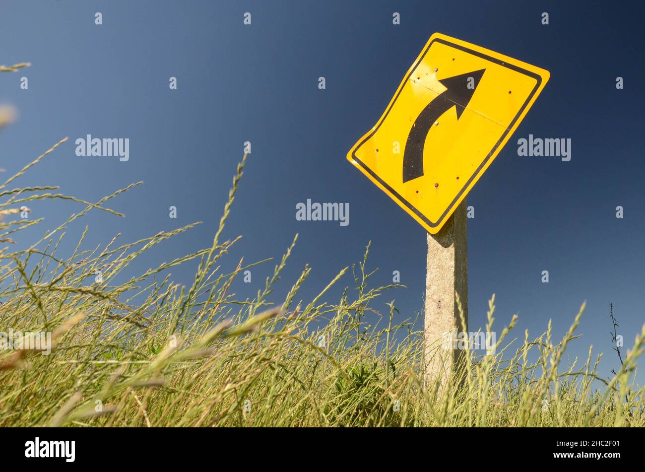 Right turn sign. Traffic sign depicting a right turn on the road. Deep ...