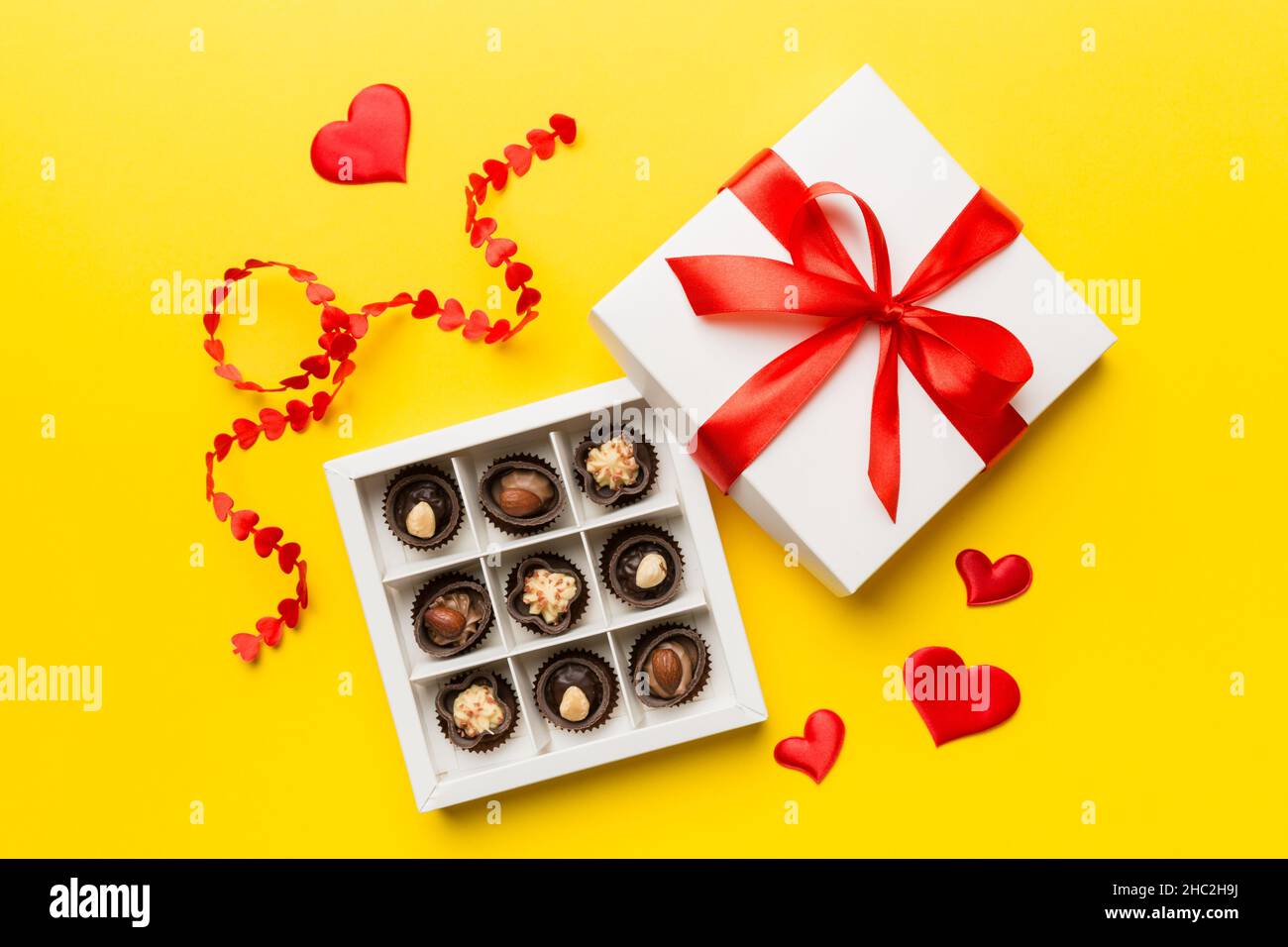 Delicious chocolate pralines in red box for Valentine's Day. Heart ...
