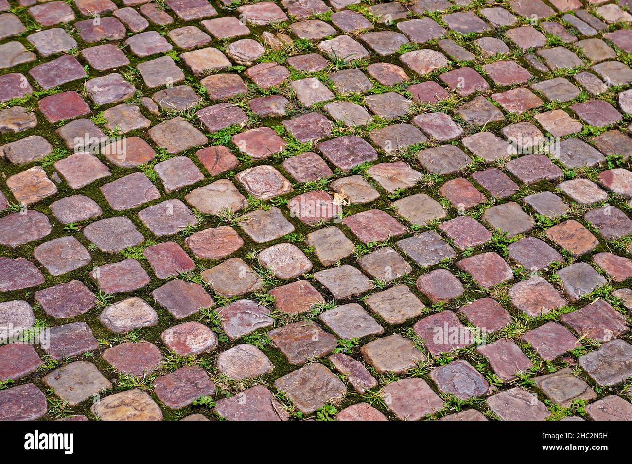 Cobblestone with moss texture background Stock Photo - Alamy