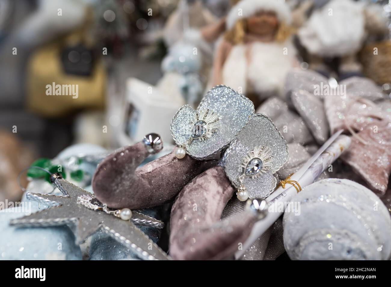 Different object toy gifts hanging from a decorated Christmas tree ...