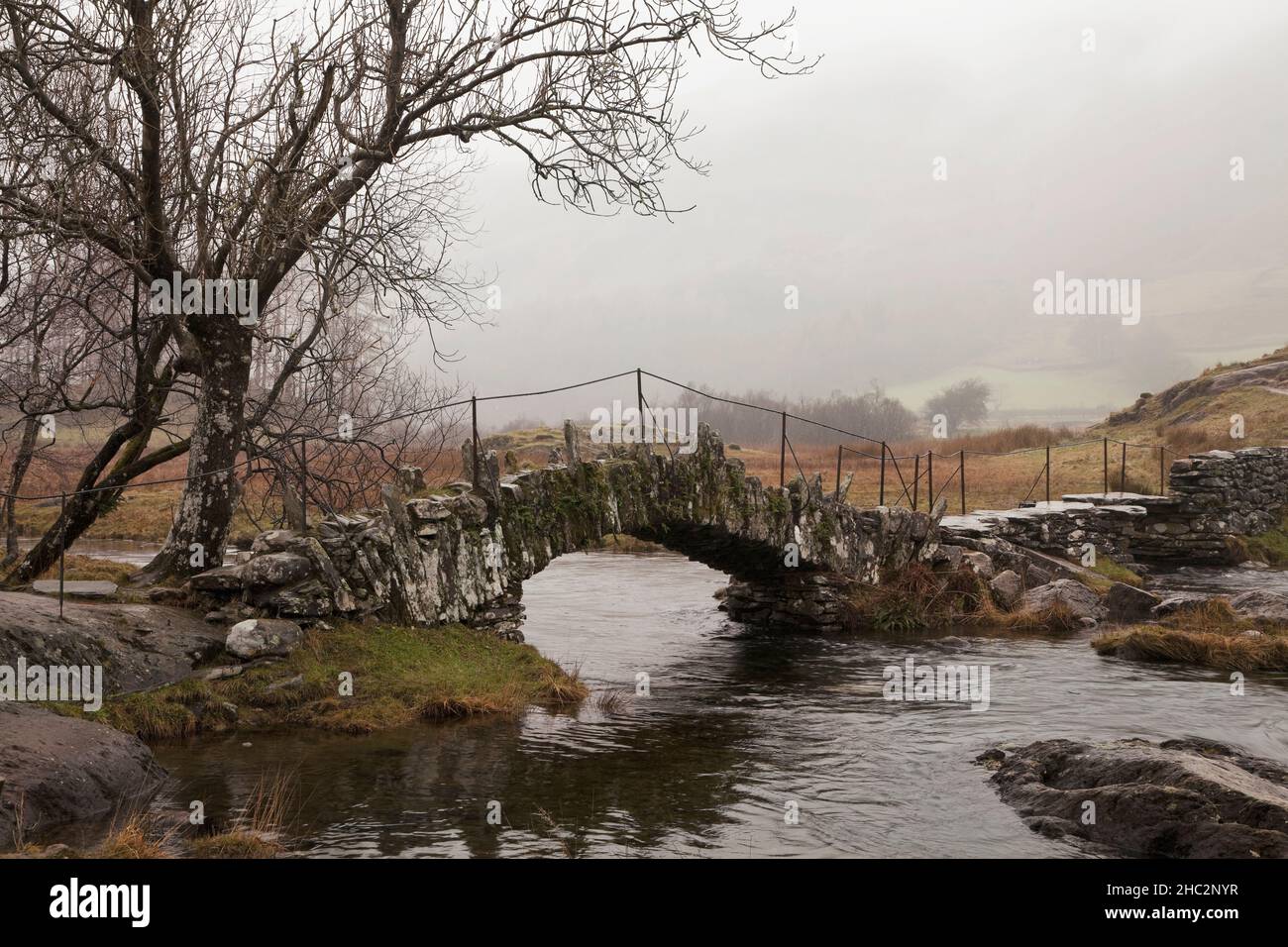 Slater Bridge over the River Brathay in Little Langdale, in the English ...
