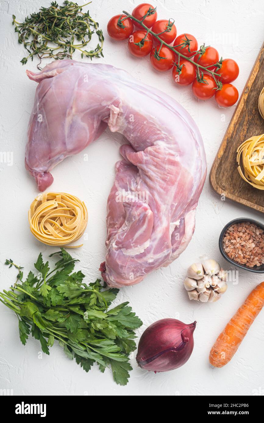 Whole rabbit, Raw meat with spices and vegetables, ingredients for ...