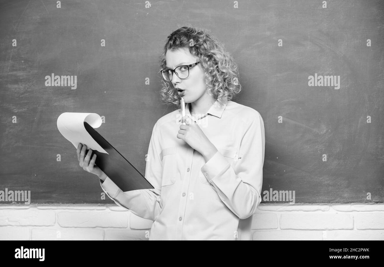 Woman school teacher hold folder documents. Plan of lesson. According ...