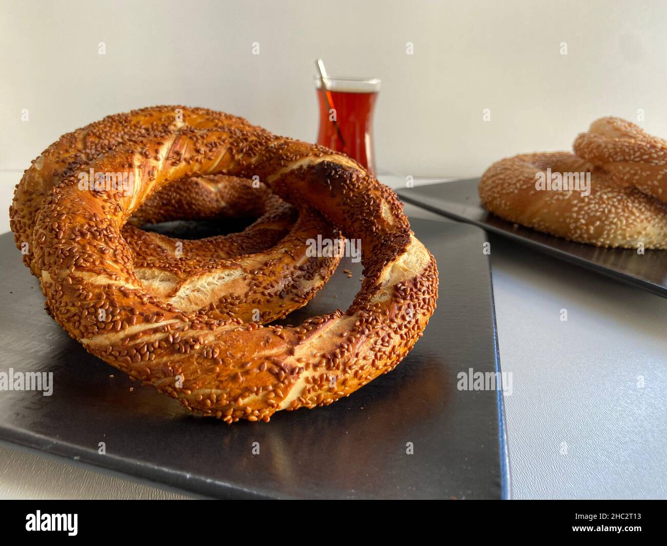 Simit or gevrek, traditional Turkish street food with tea. Breakfast ...