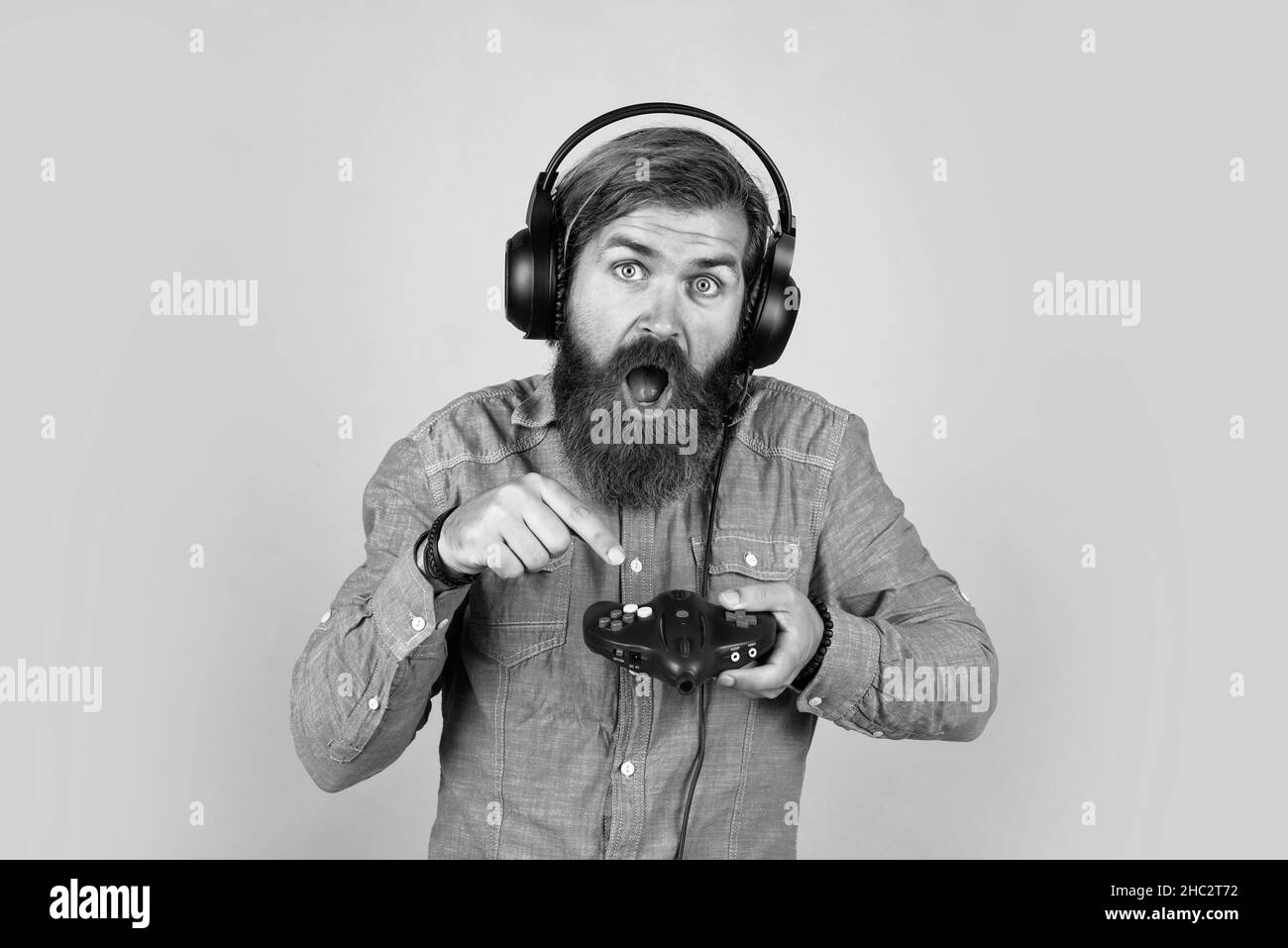 Professional male gamer playing Black and White Stock Photos & Images ...