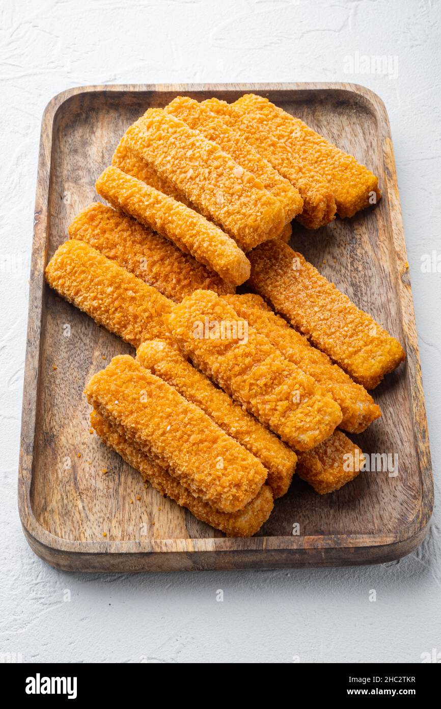 Frozen fish Sticks set, on wooden tray, on white background Stock Photo ...