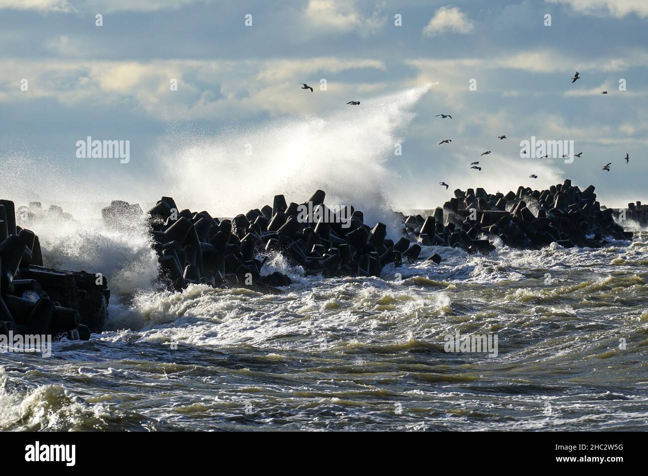 coastal storm in the Baltic Sea, big waves crash against the concrete ...