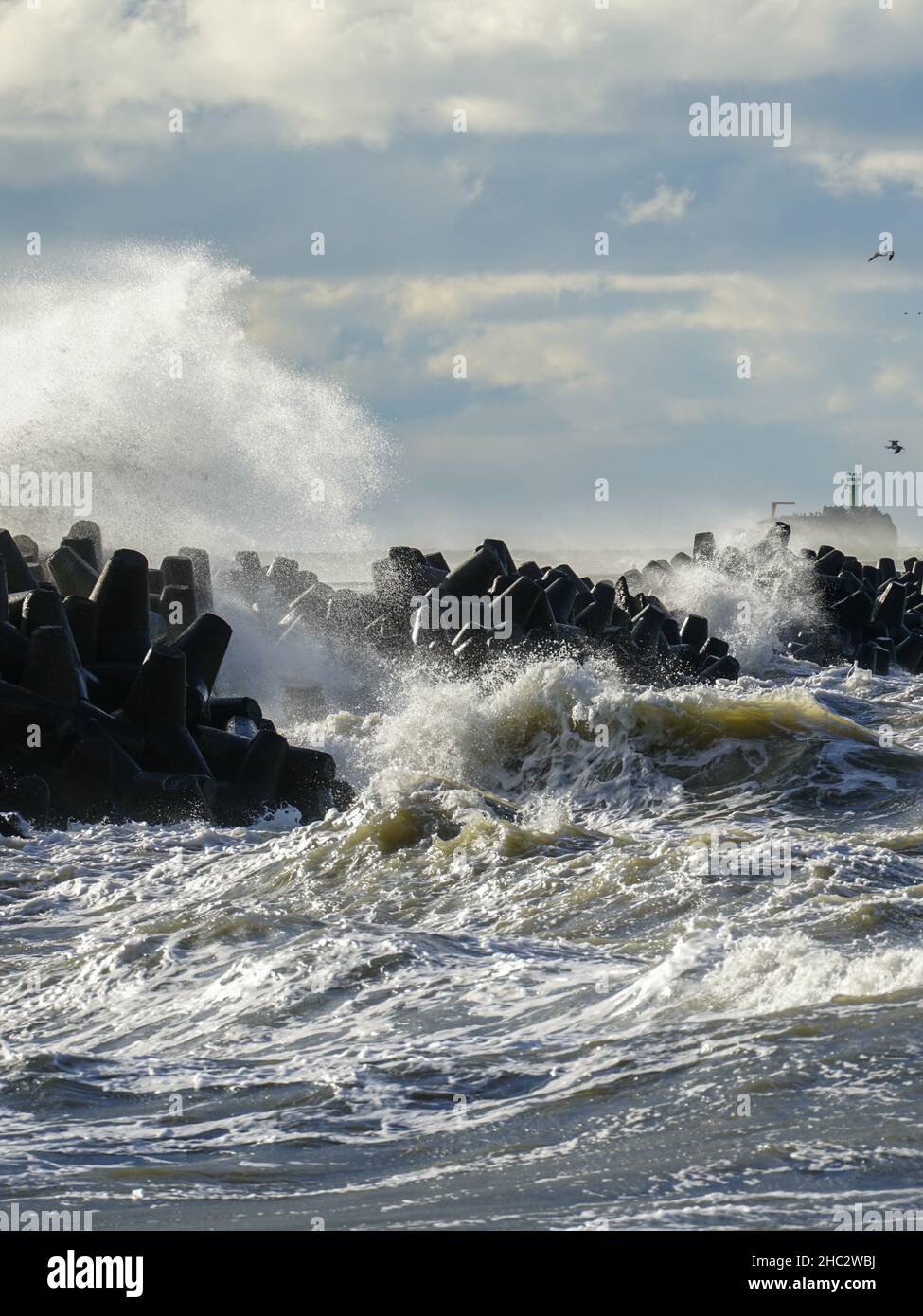 coastal storm in the Baltic Sea, big waves crash against the concrete ...