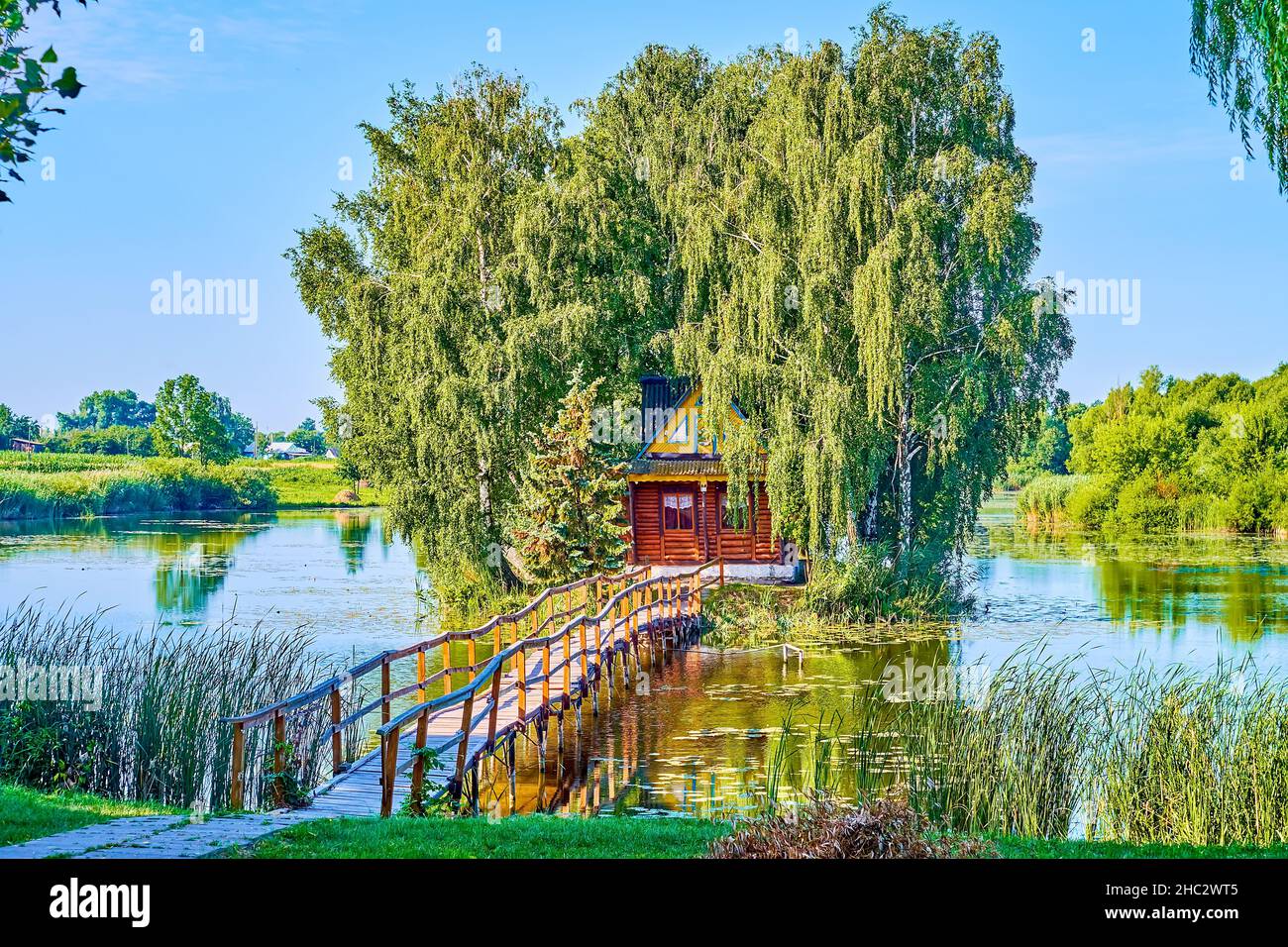 The timber Fisherman's House on the Islet, stilt footbridge across ...
