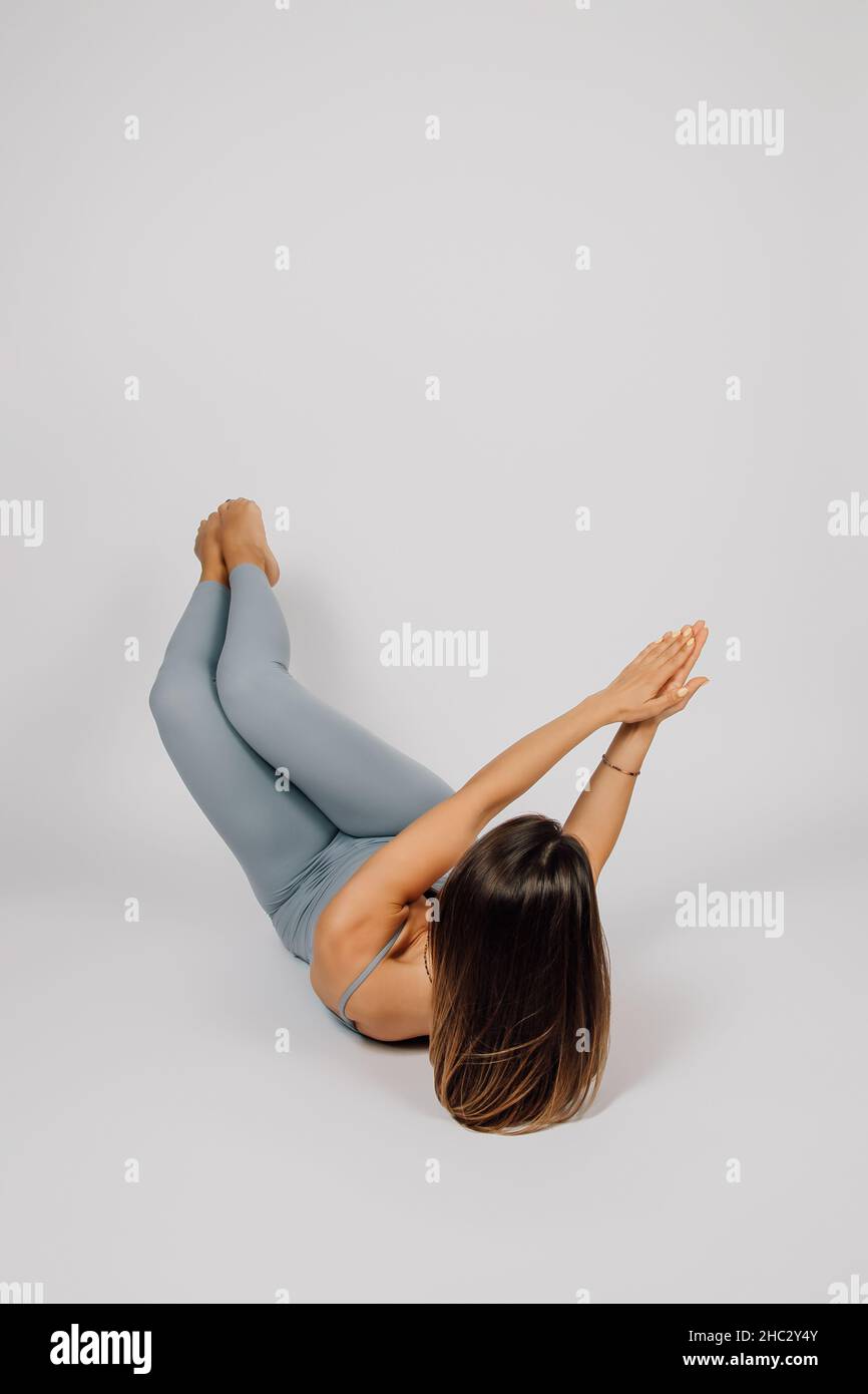 Woman Does Sports Beautiful Brunette Is Doing Exercise From Yoga Or Fitness She Is Lying On