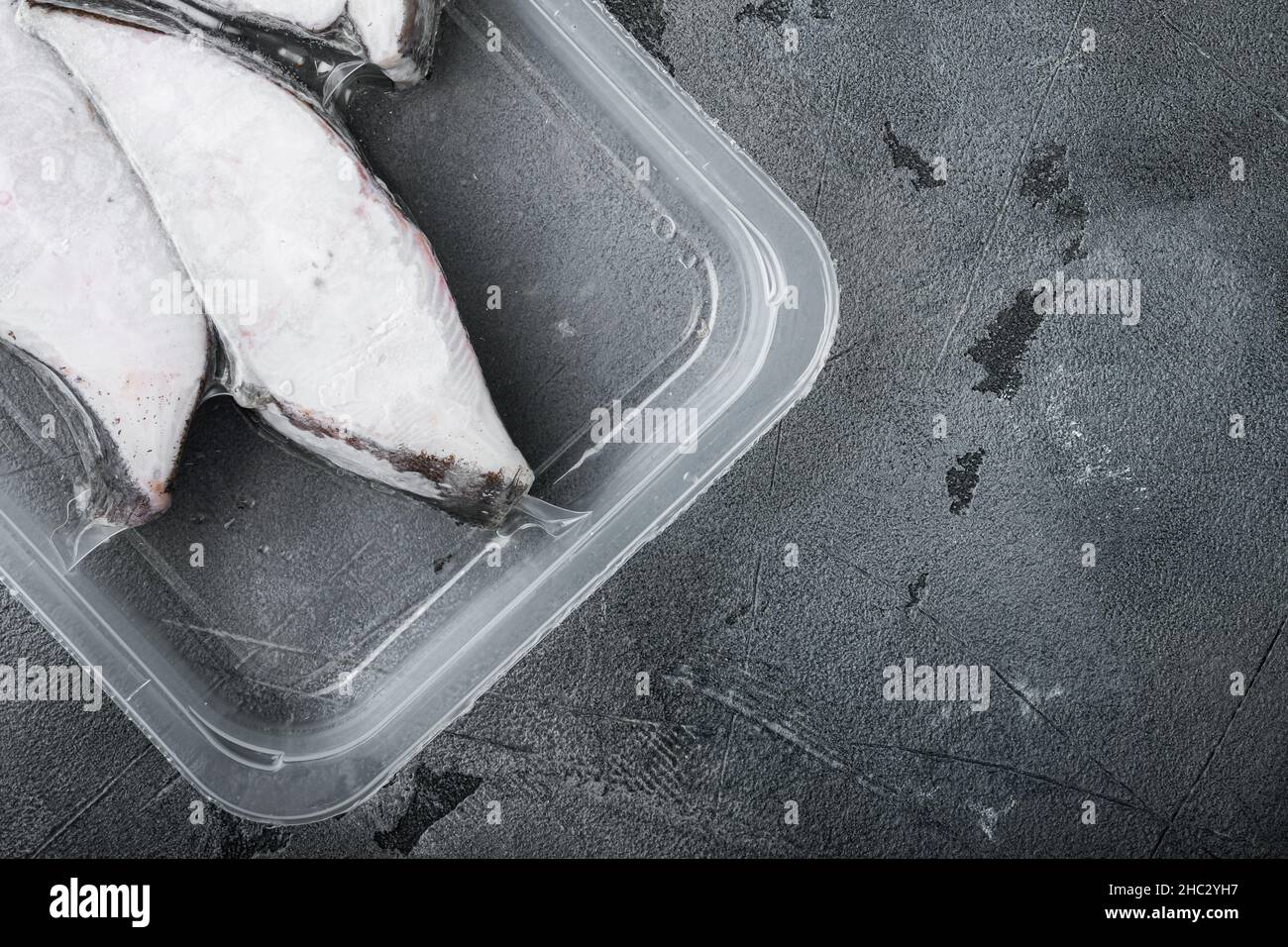Frozen halibut pack set, on gray stone table background, top view flat ...