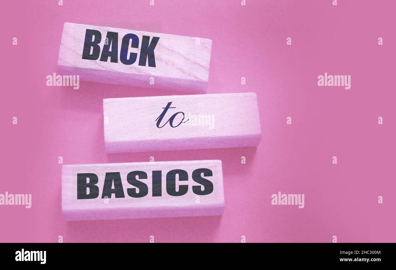The words back to basics made of letters on wooden blocks. back to ...