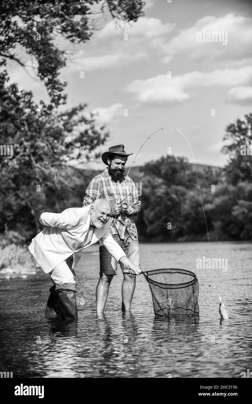 We can do it. Catching and fishing concept. Two male friends fishing ...
