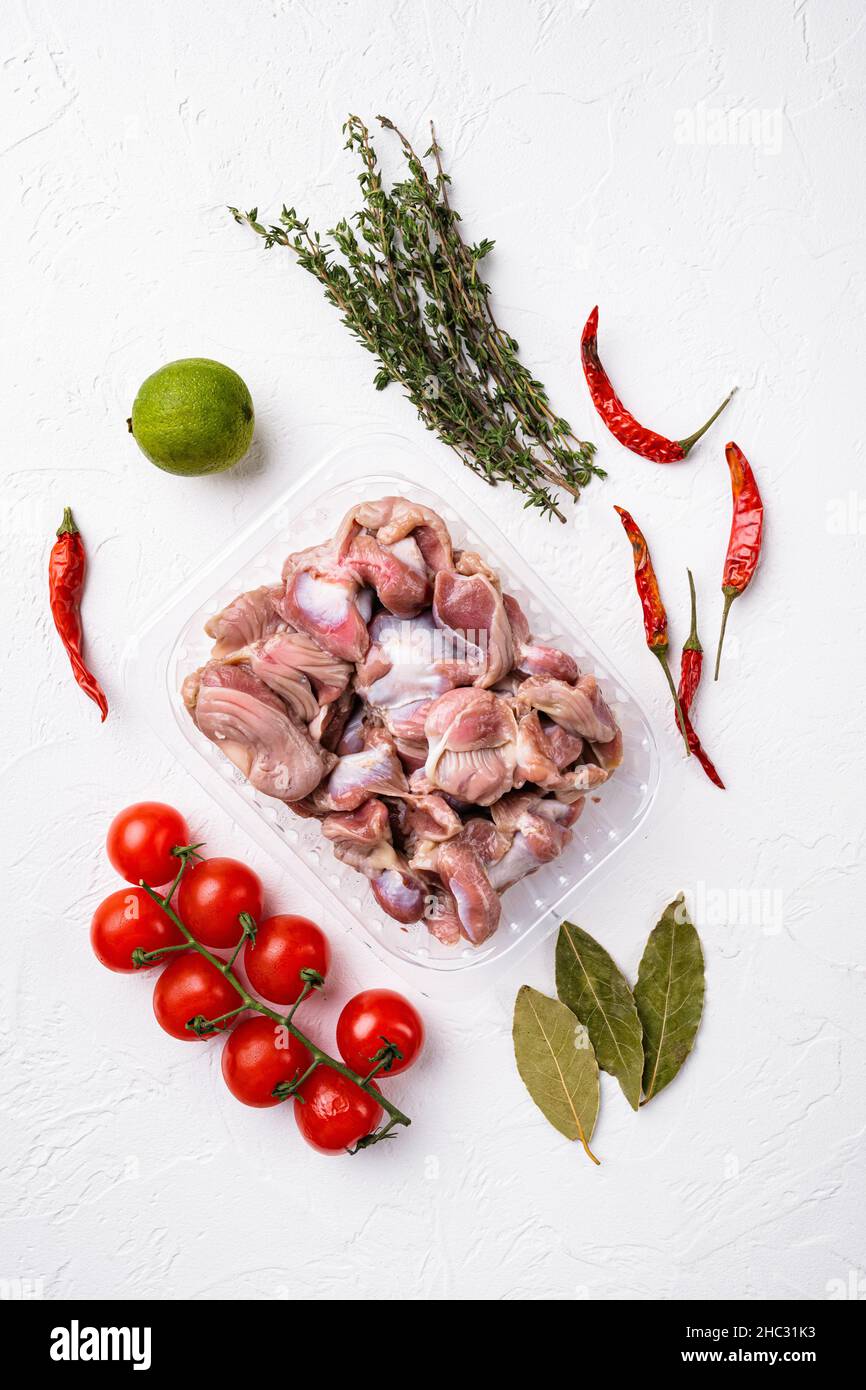 Chicken stomach container set, on white stone table background, top ...