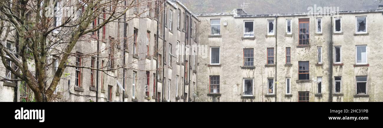 Derelict council house in poor housing estate slum with many social ...