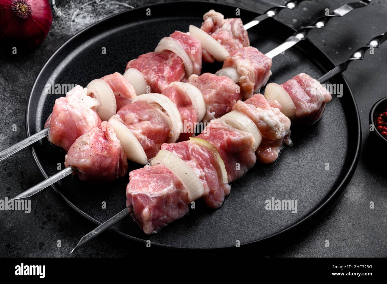 Raw kebab set, on black dark stone table background Stock Photo - Alamy