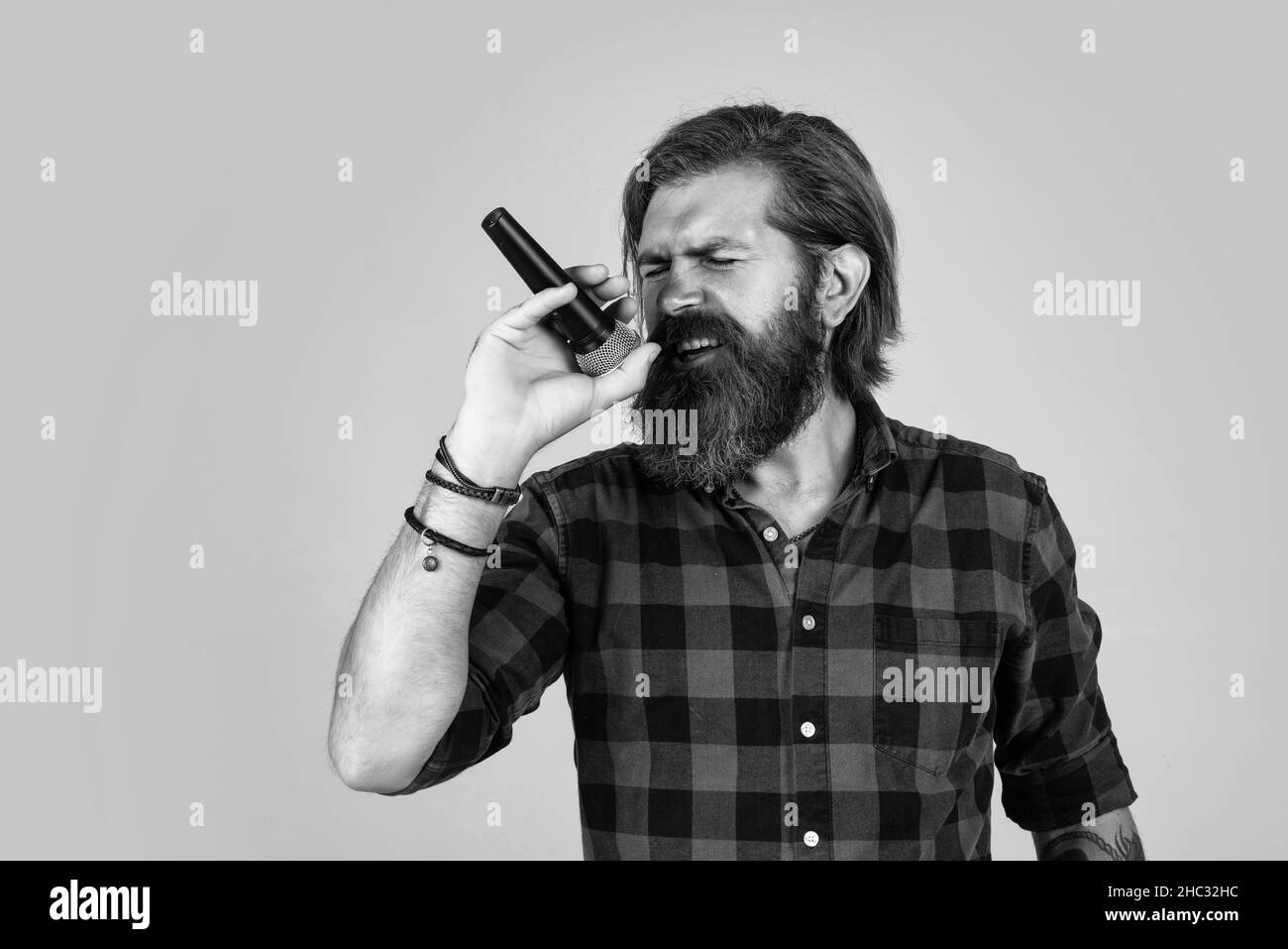 male singer with mic. concept of karaoke. man singer love music. brutal ...