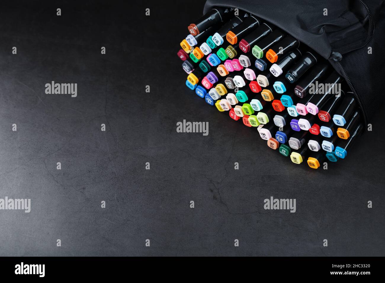 Professional sketching markers of different colors in a bag on a dark ...
