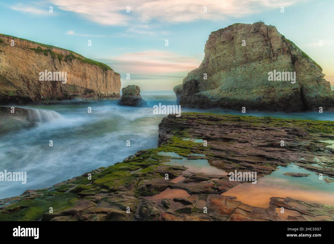 A breathtaking coastal scene with towering Shark Fin sea stack rising ...