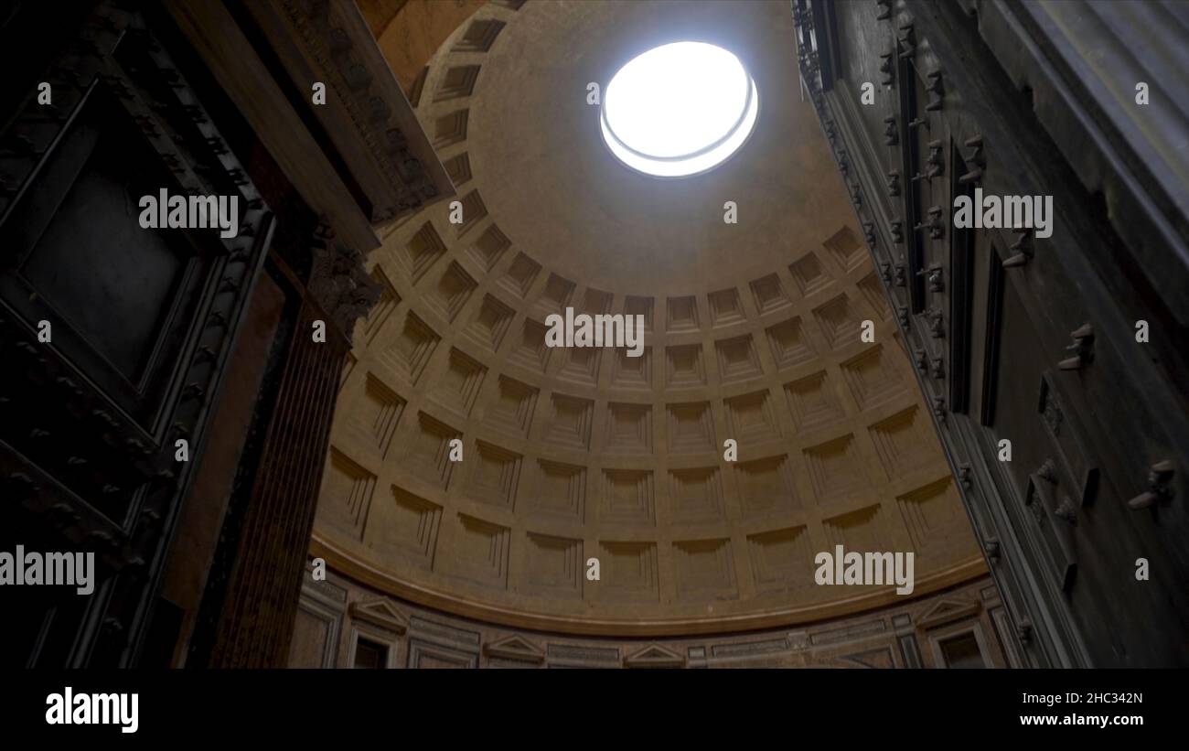 Temple indoor interior with dome round window and the bright light ...