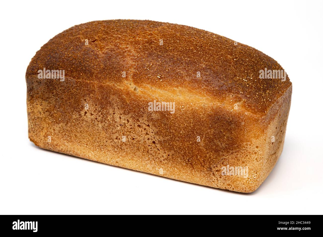 loaf of golden wheat bread brick isolated on white background, homemade ...