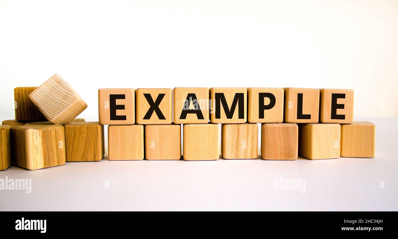 Example symbol. The concept word Example on wooden cubes. Beautiful ...