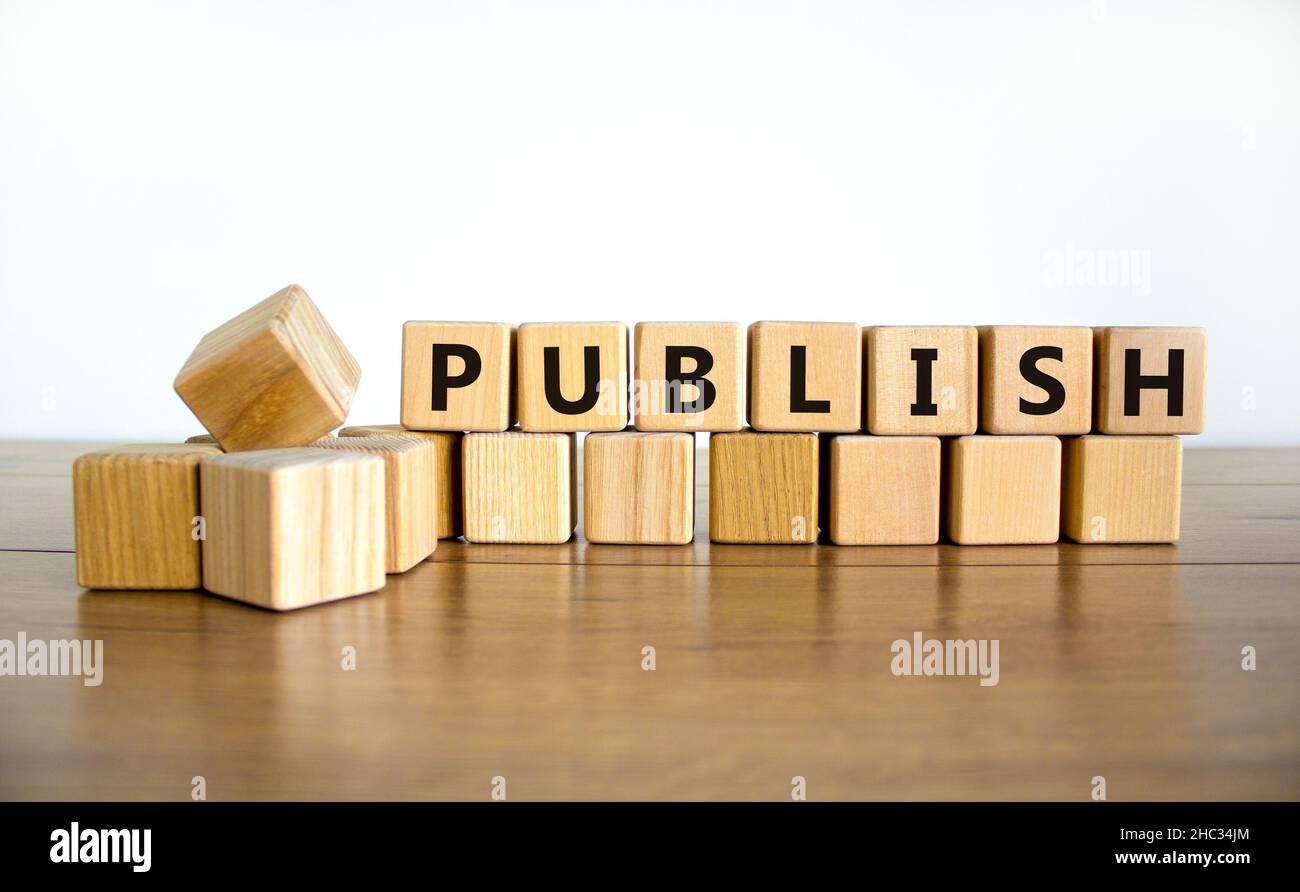 Publish symbol. The concept word Publish on wooden cubes. Beautiful ...