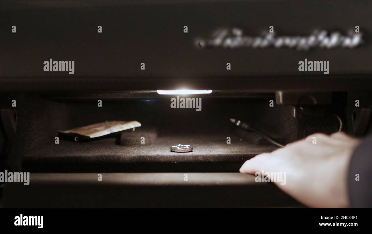 Hand open glove compartment box in car. Luxurious car glove compartment ...