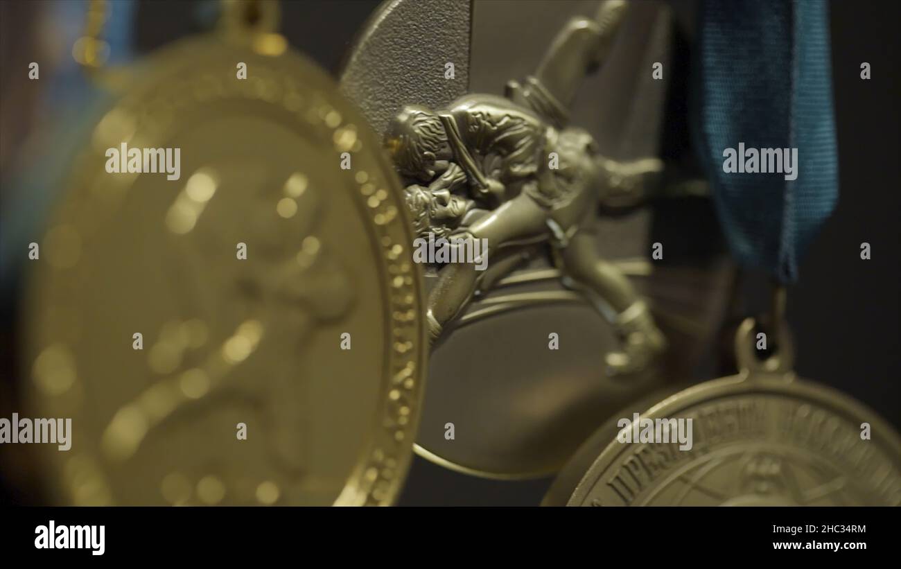 Close up of the golden medals. A rugged gold medal setup majestically ...