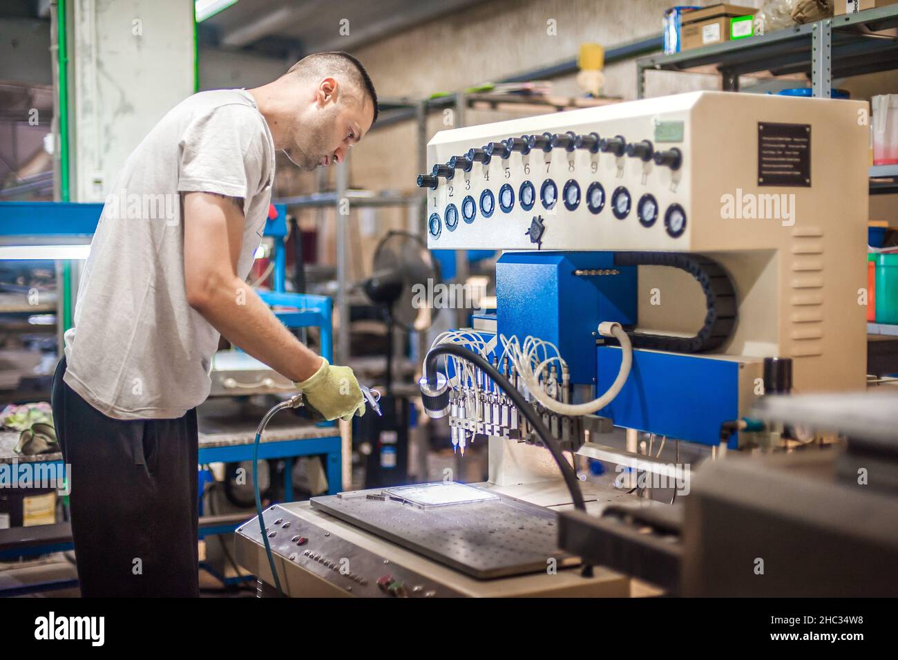 Professional worker machinist engineer technician operating with soft ...