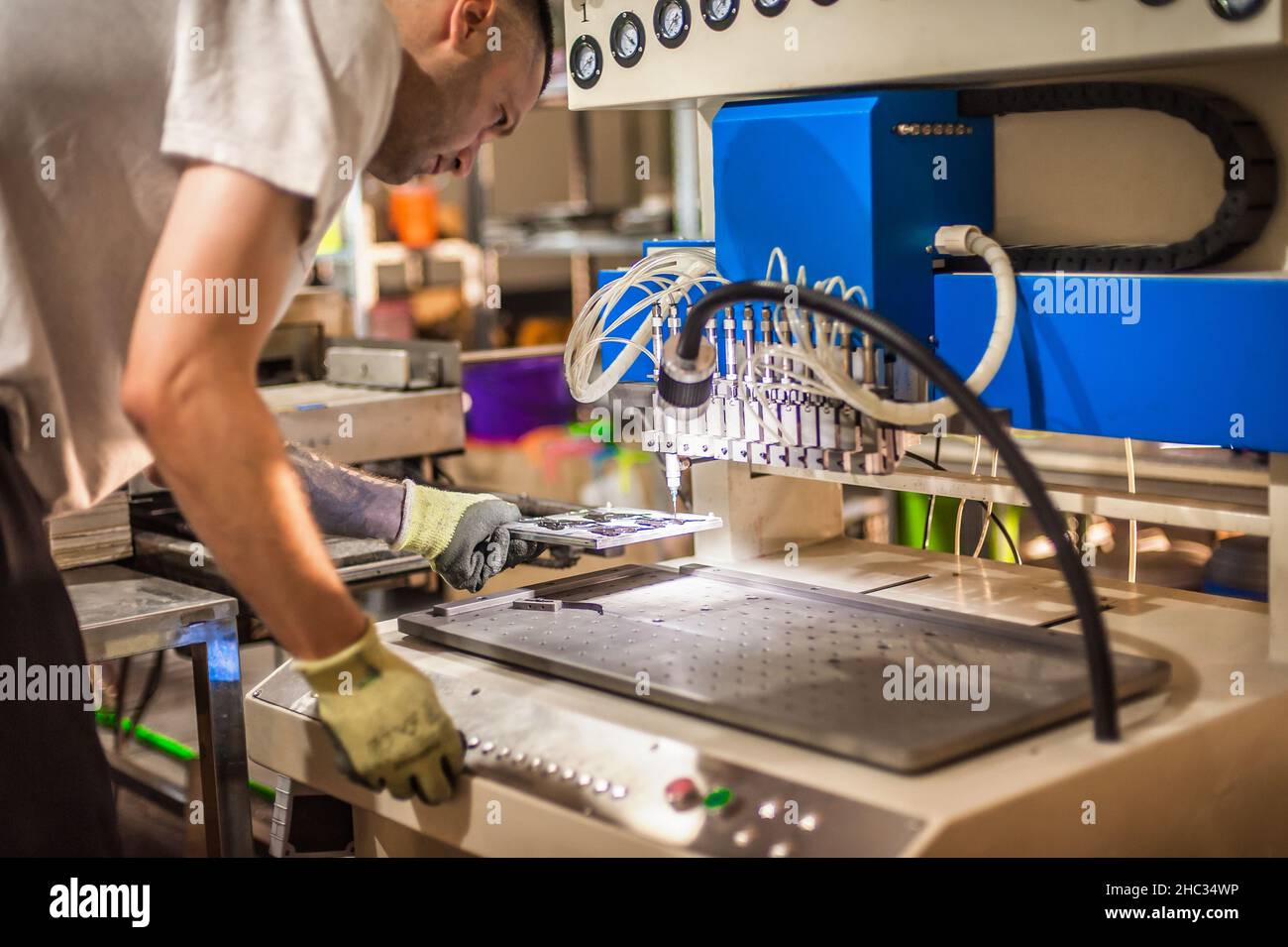 Professional worker machinist engineer technician operating with soft ...