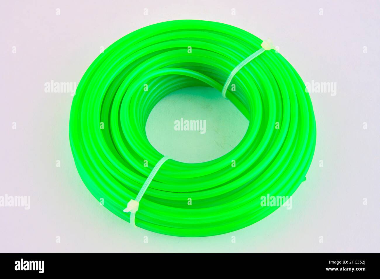 A string of grass cutter on white background Stock Photo - Alamy