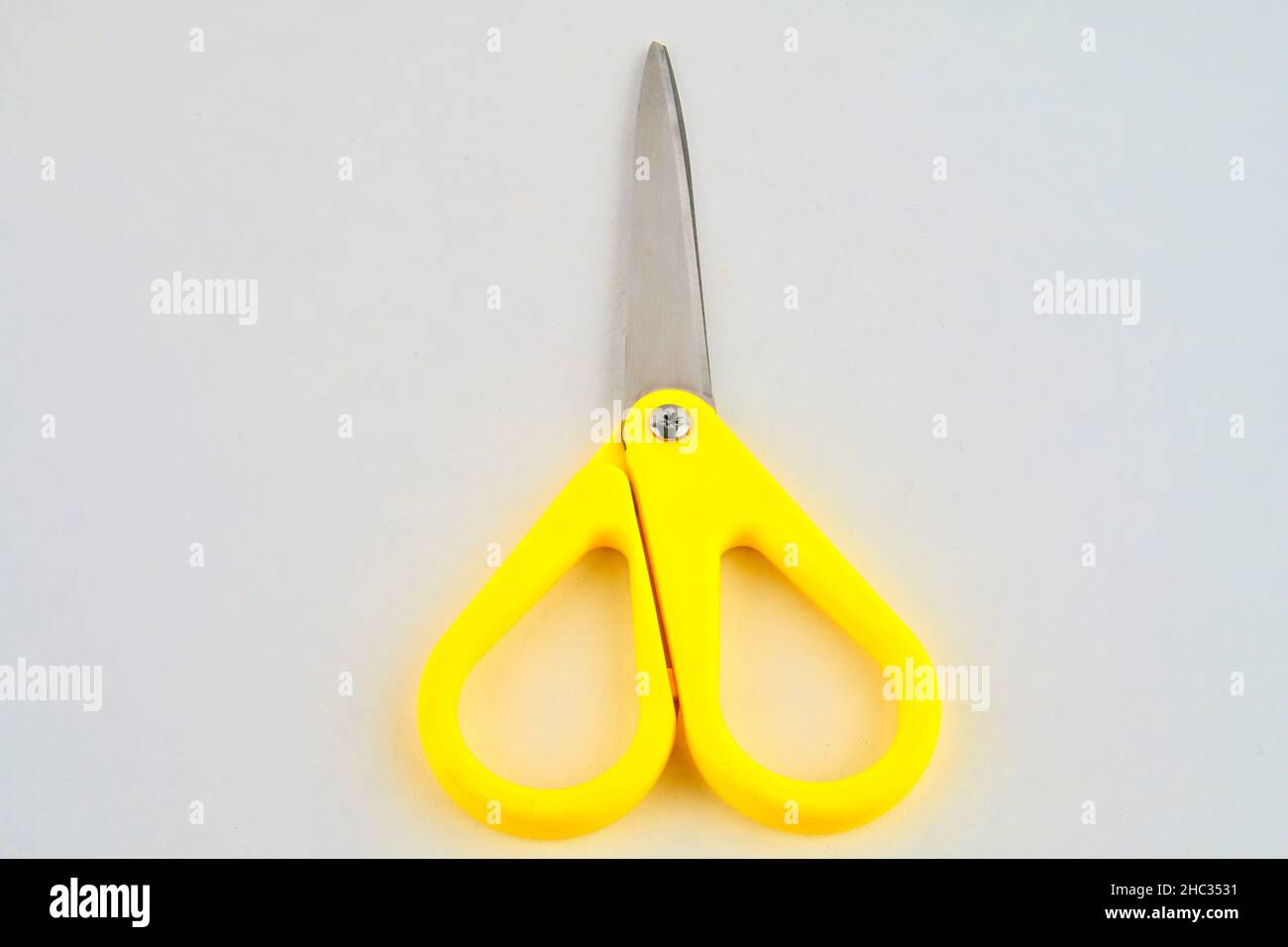 Yellow scissors isolated on a white background. Flat design. Top view ...