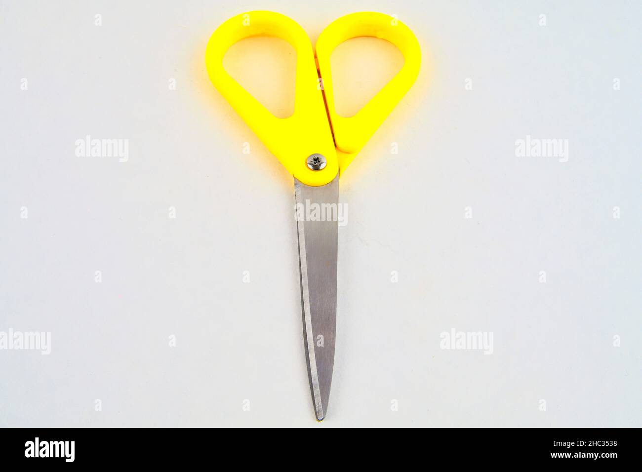 Yellow scissors isolated on a white background. Flat design. Top view ...