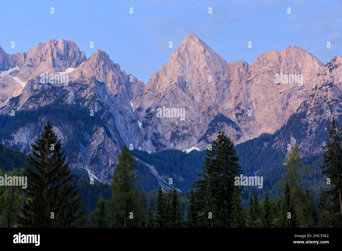 before sunrise the spik mountain in early lights, slovenian alps ...
