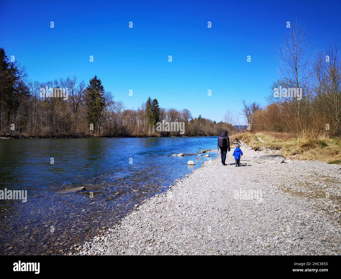 Father son walk near river on boulder Stock Photo - Alamy