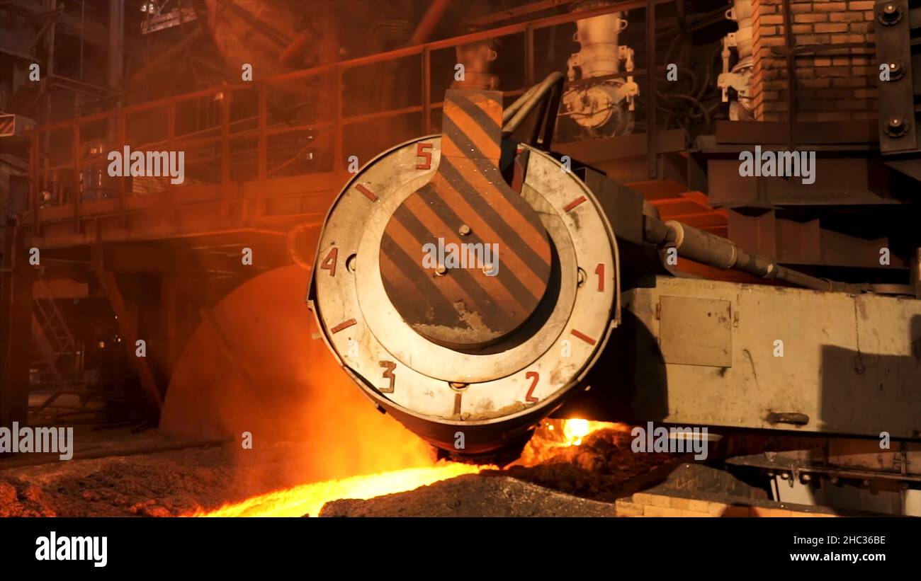 Molten steel in high temperature melting at the metallurgical plant ...