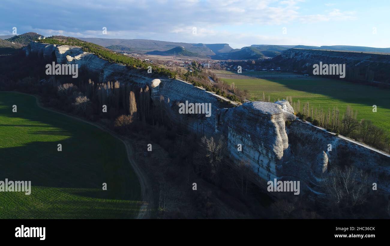 Aerial view of stunning natural stone wall, high and long cliff with ...