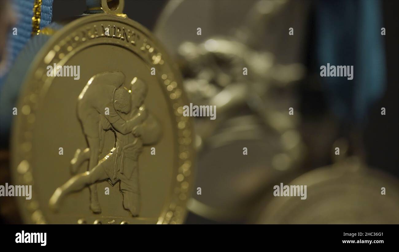 Close up of the golden medals. A rugged gold medal setup majestically ...
