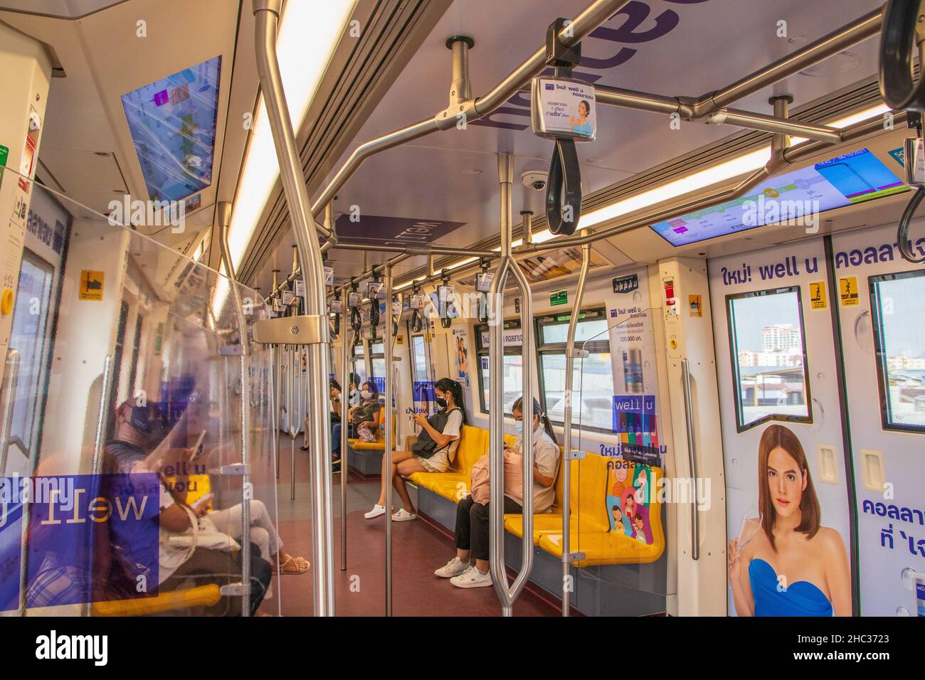 People or passengers in the interior of a Skytrain Wagon in Bangkok ...