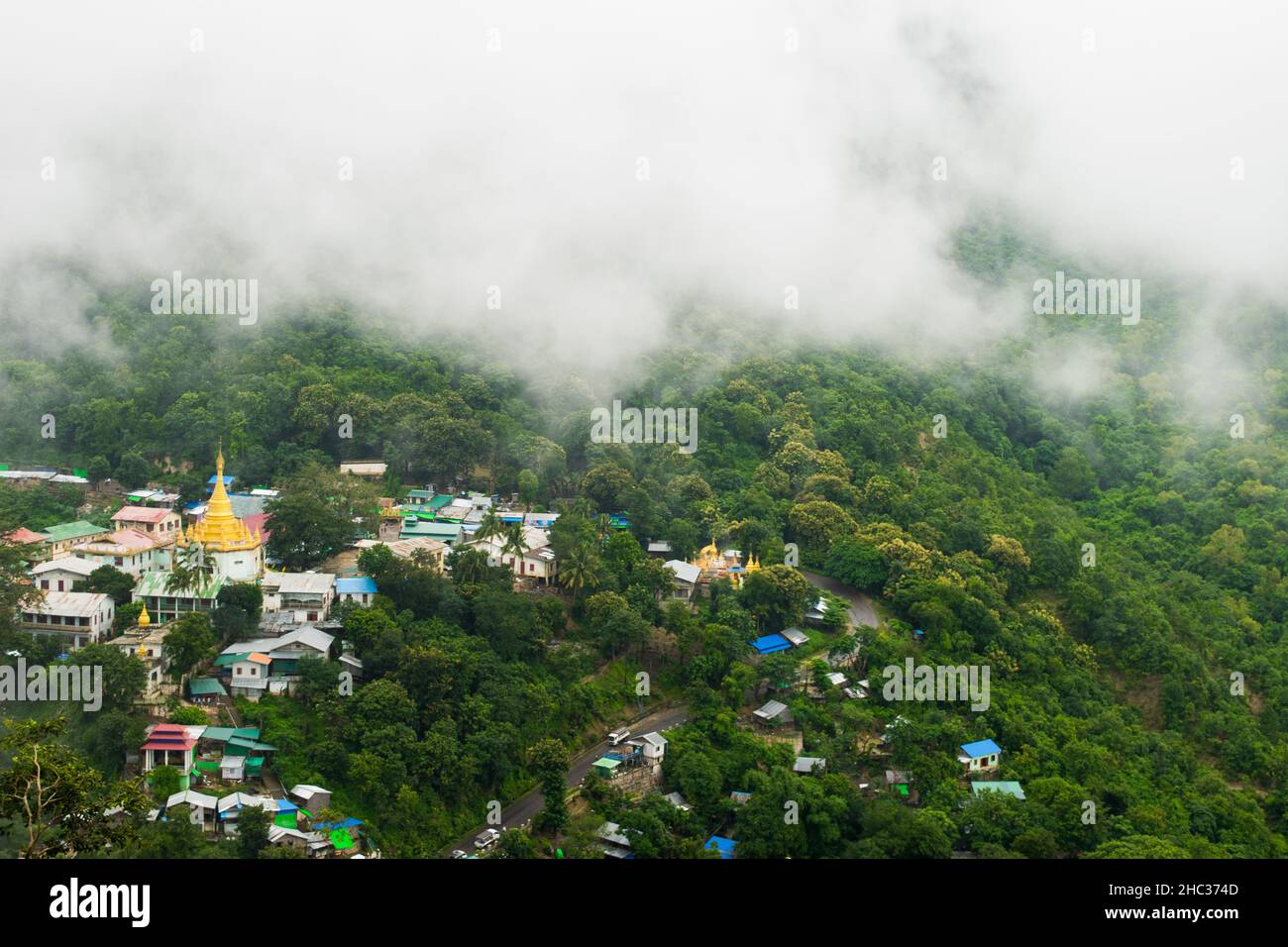 The view of countryside and forests as seen from the top of Mount Popa ...