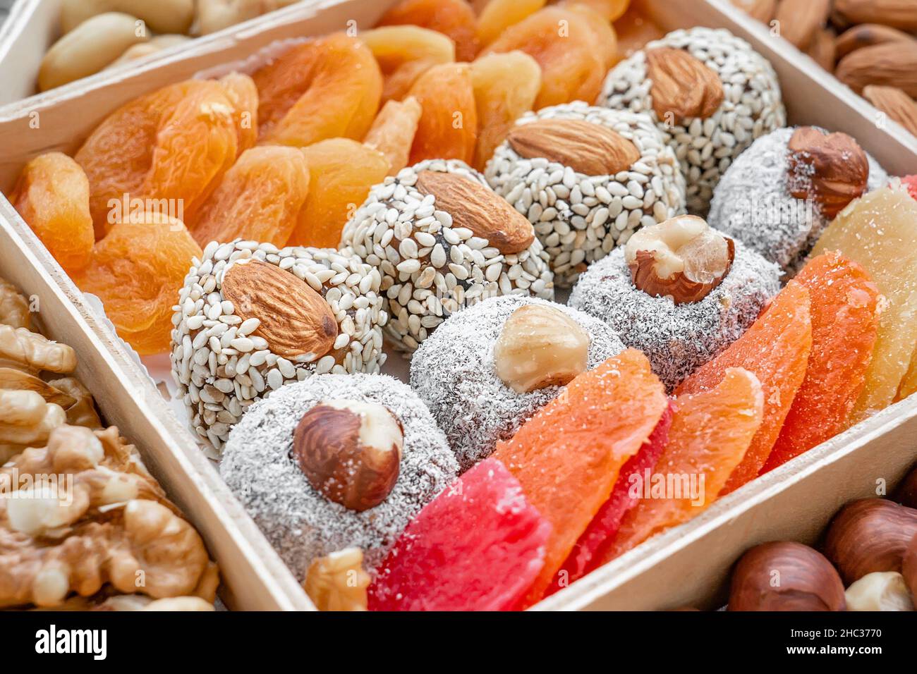Assorted dried fruits, candied fruits and nuts. Dried fruits are in ...