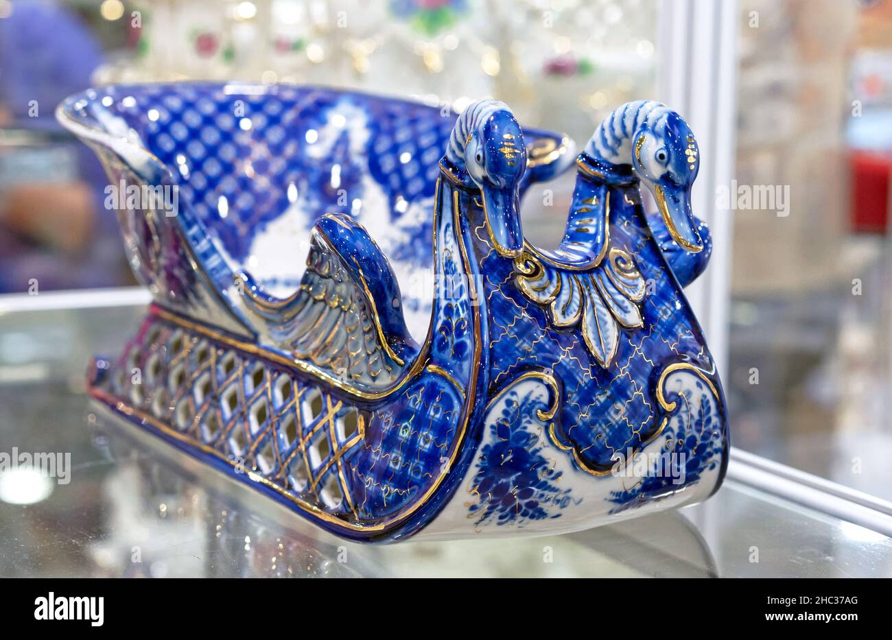 Porcelain sleigh with swans in the Russian Gzhel style. Traditional ...