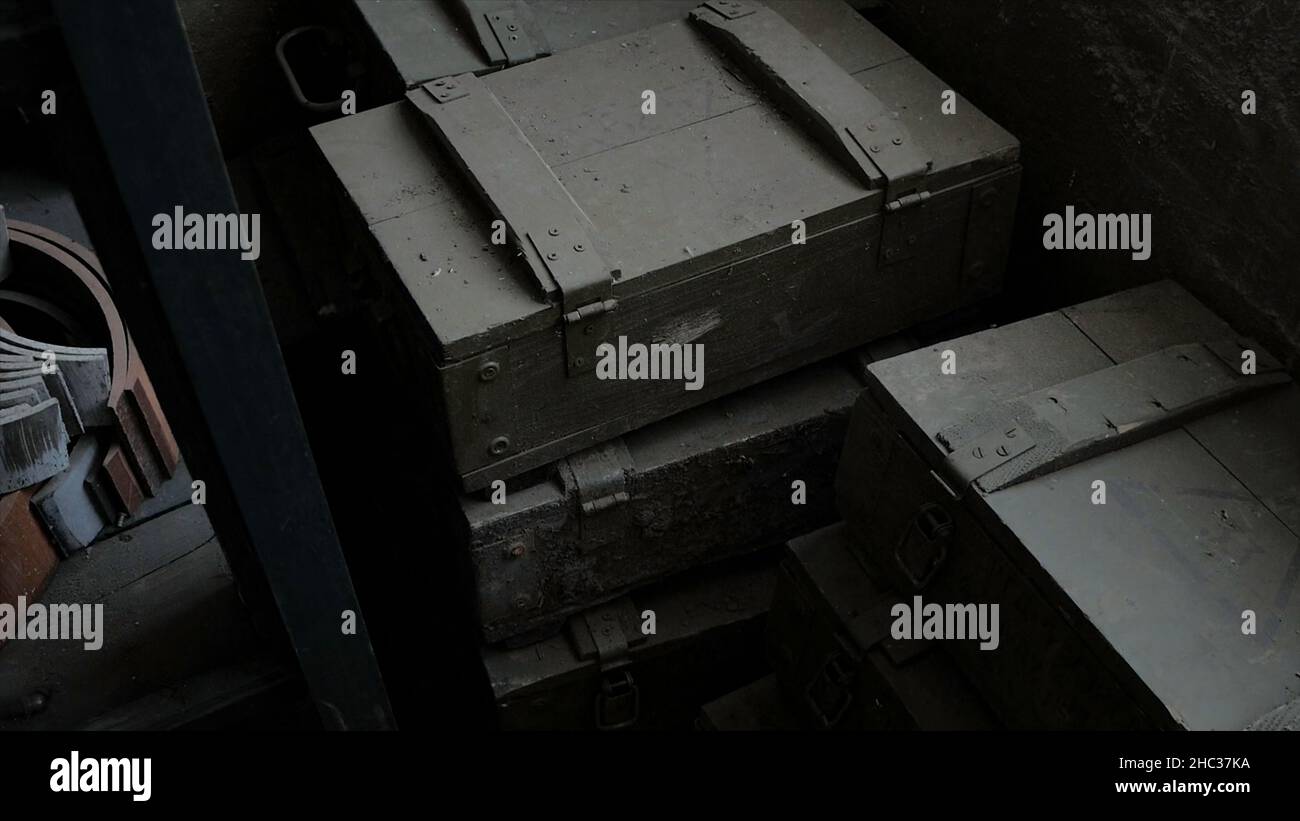 Old wooden and dusty boxes in a storage. Dusty furniture inside ancient ...