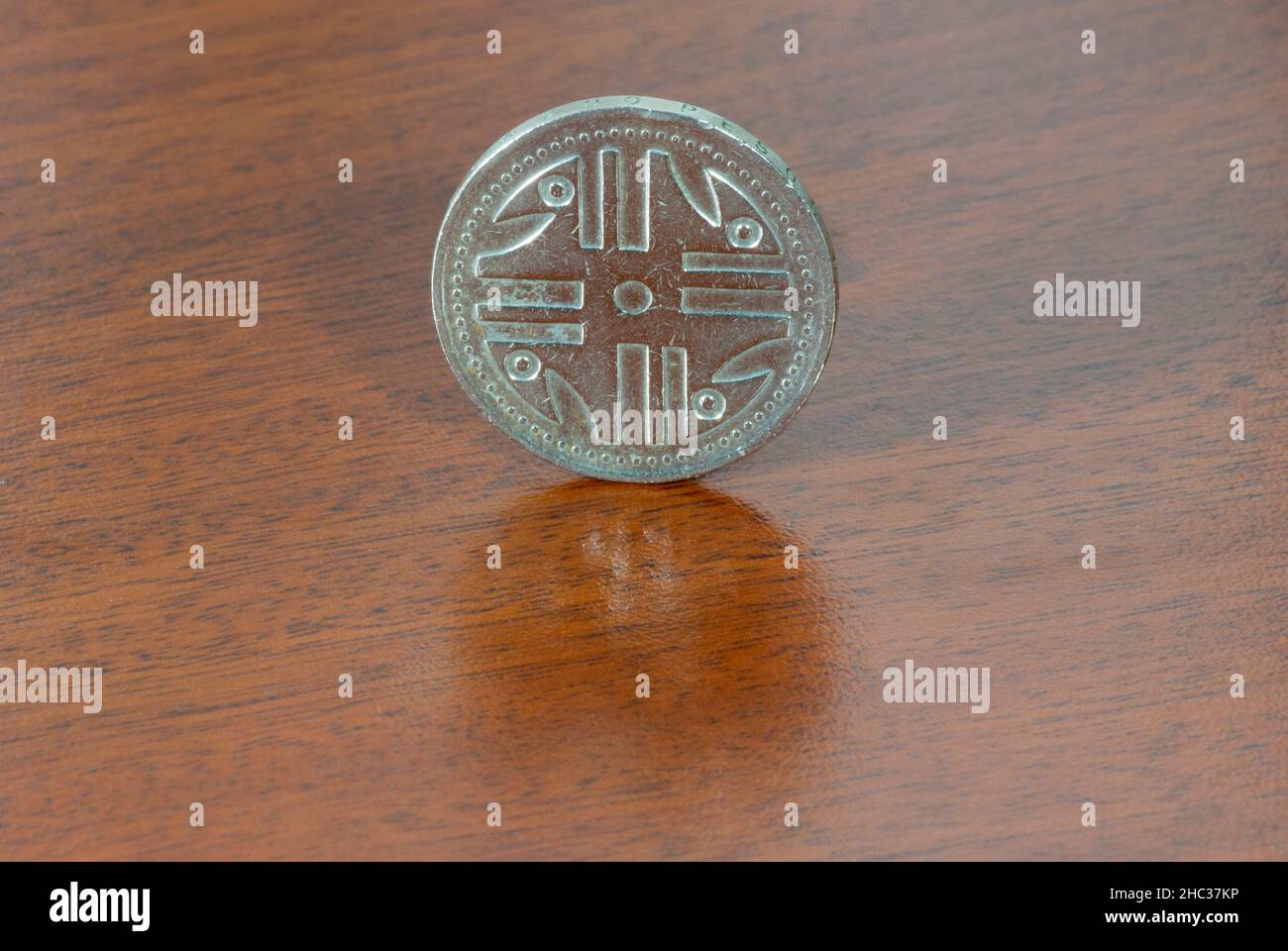 Colombian coin 200 pesos of 1997, currency over wood texture Stock ...