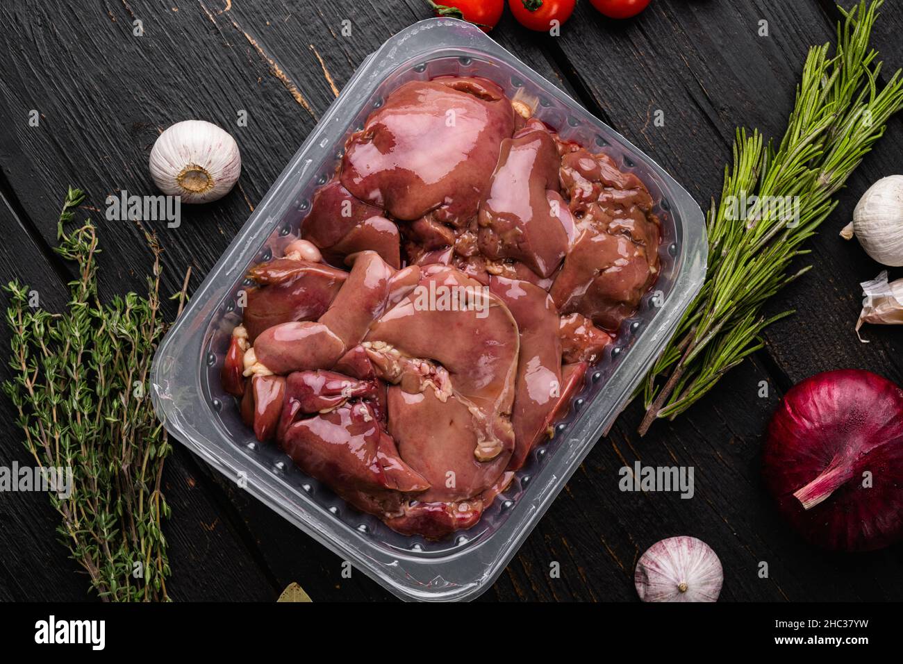 Chicken liver container set, on black wooden table background, top view ...