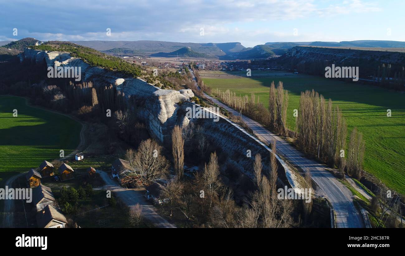 Aerial view of stunning natural stone wall, high and long cliff with ...