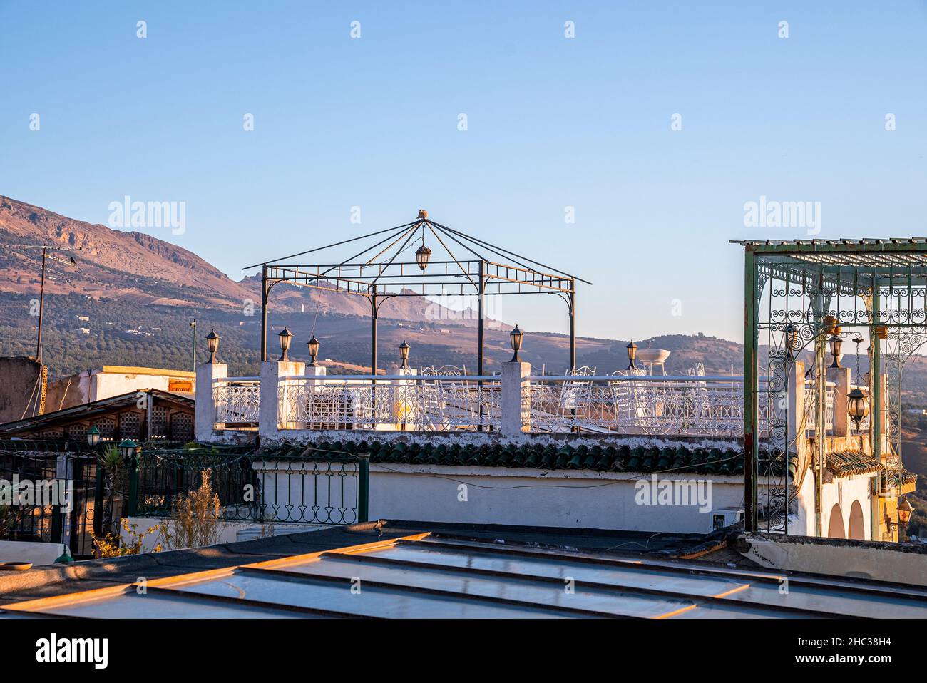 Open air rooftop restaurant and mountain landscape against sky Stock ...